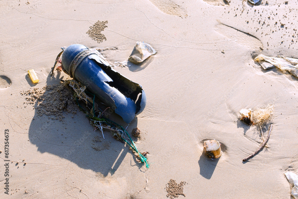 Garbage Plastic and bottles spill are left on the beach as waste ...