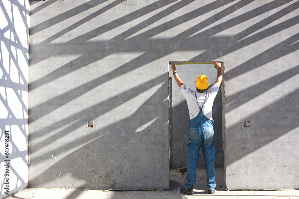 construction worker carpenter in building shell construction site ...