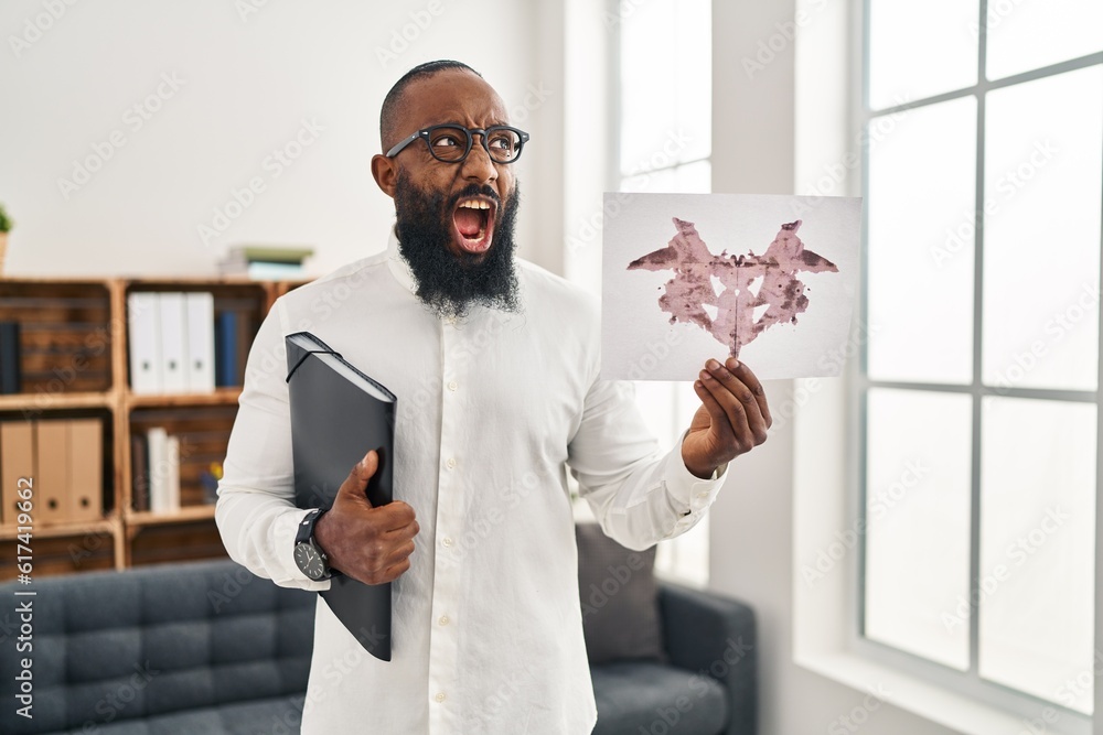 African american man working with rorschach test at psychology clinic ...