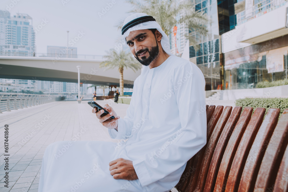 Beautiful middle eastern man wearing kandora traditional outfit in ...