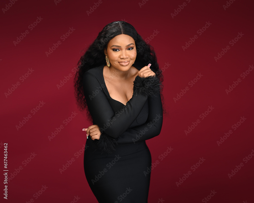 Young female millennial woman standing in profile on red background ...