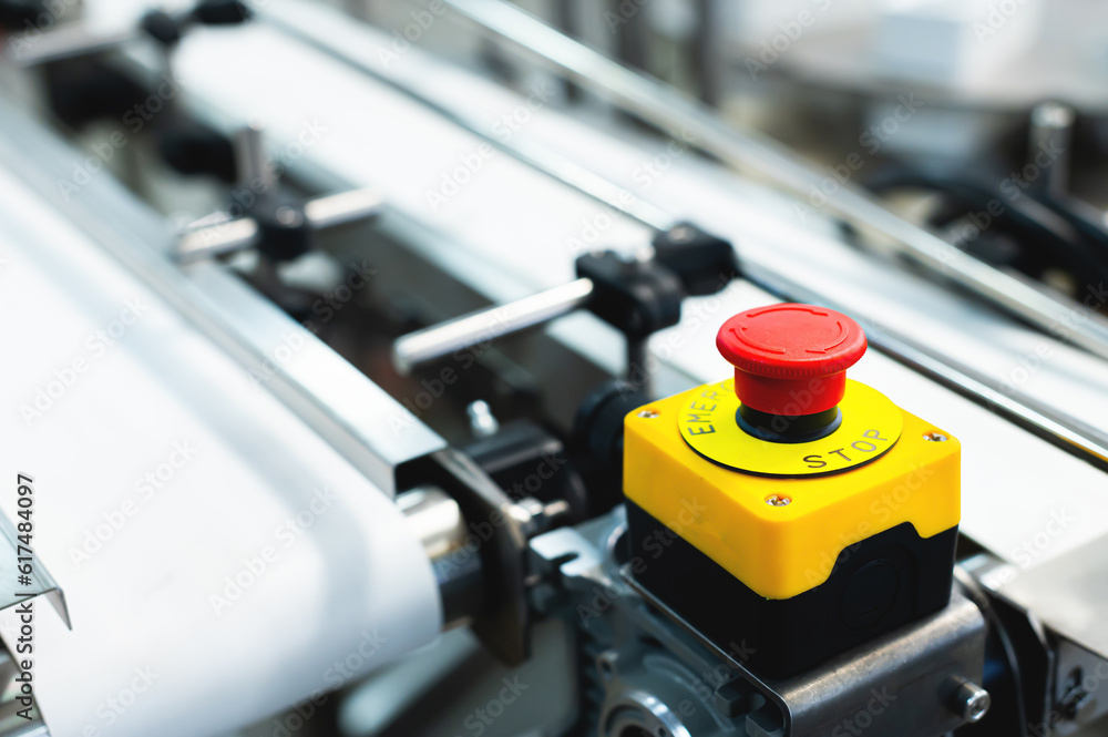 Emergency stop button of the production line on the background of the ...
