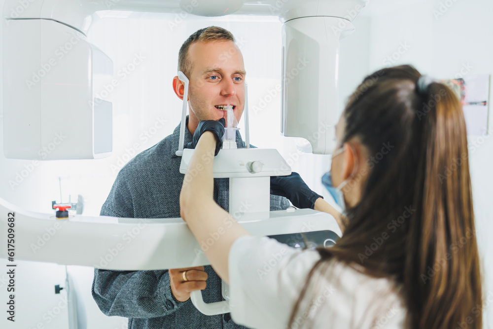 A young man underwent a CT scan of the jaw, a circular image of the jaw ...