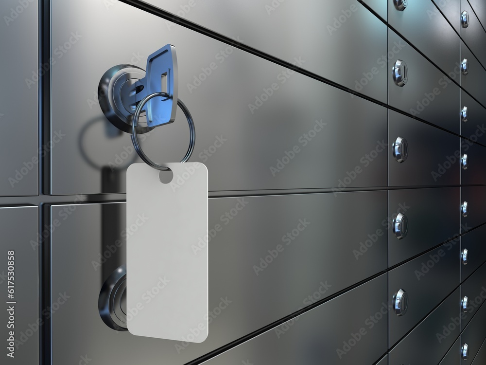 Safe deposit boxes in bank, a closeup of a key with an blank label in ...