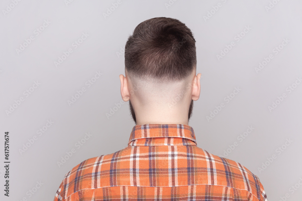 Back view portrait of dark haired bearded man with stylish hairstyle ...