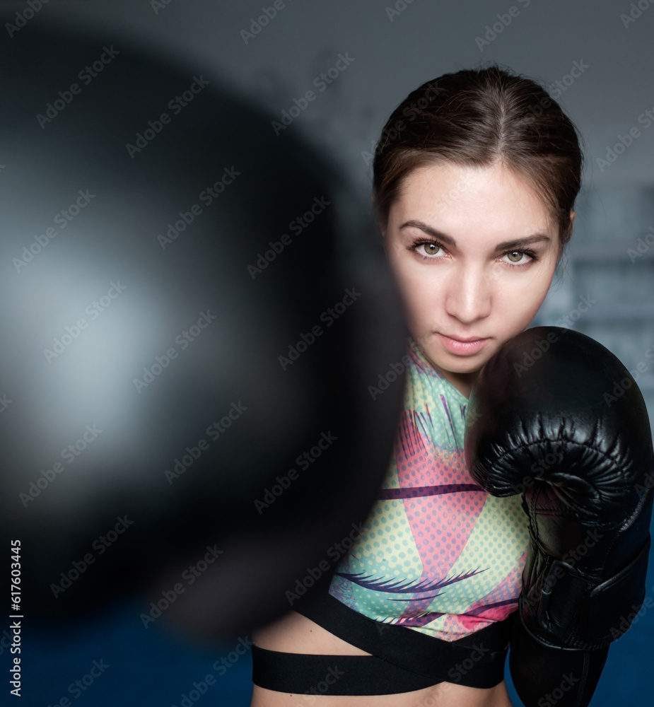 Young adult sexy boxing girl posing with gloves. Confident woman ready ...