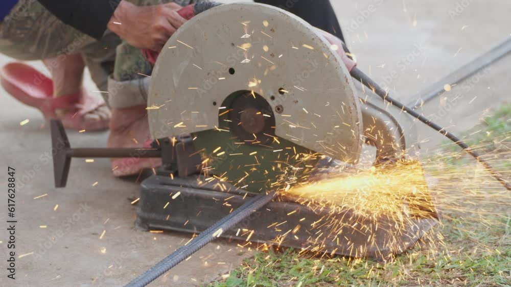 Close up of hand of talented builder skillfully uses metal cutters to ...