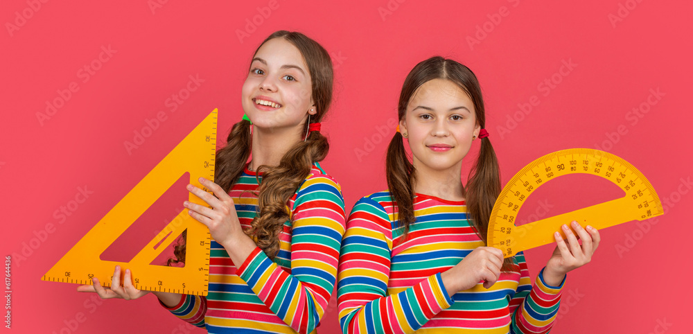 smiling school students hold math tool of triangle and protractor Stock ...