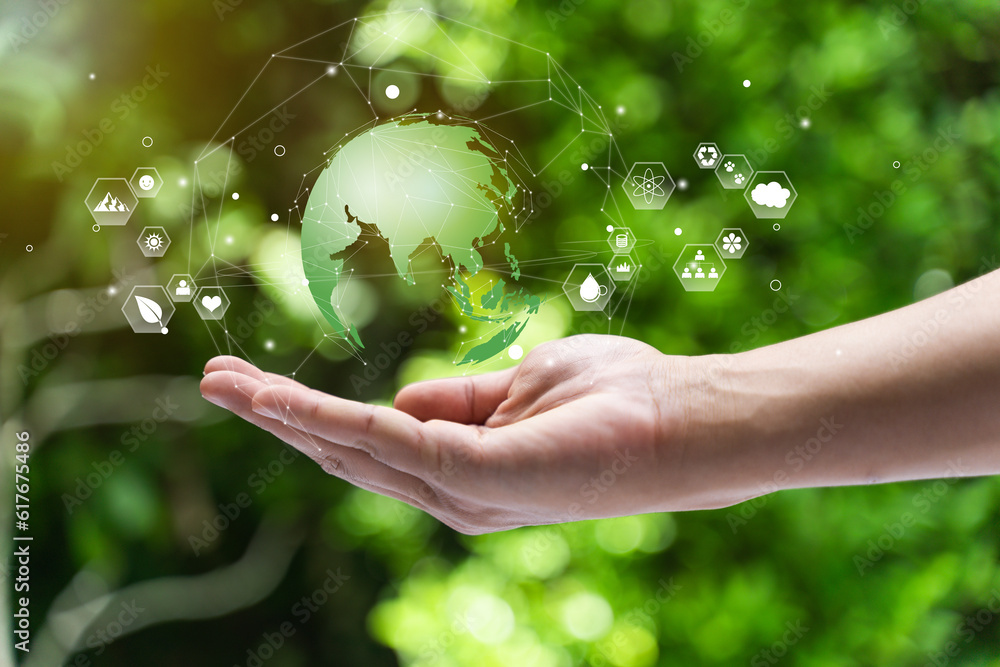 Glass globe in green forest with the icon environment of ESG, co2 ...