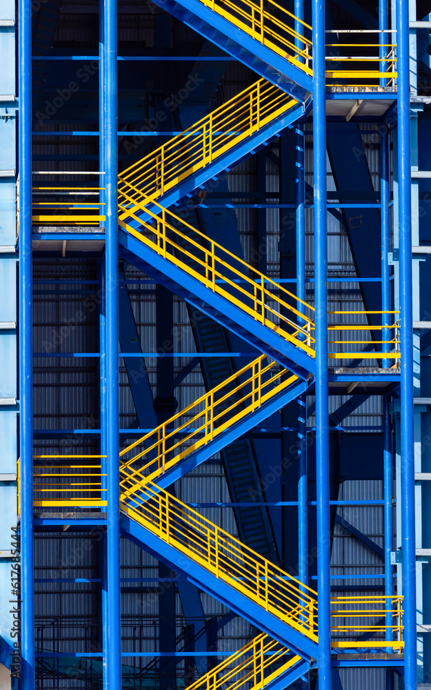Metal construction fire escape ladder with blue and yellow . .Escape ...
