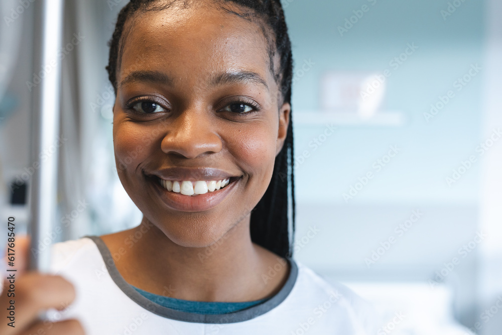 Portrait of happy african american female patient with braids, wearing ...