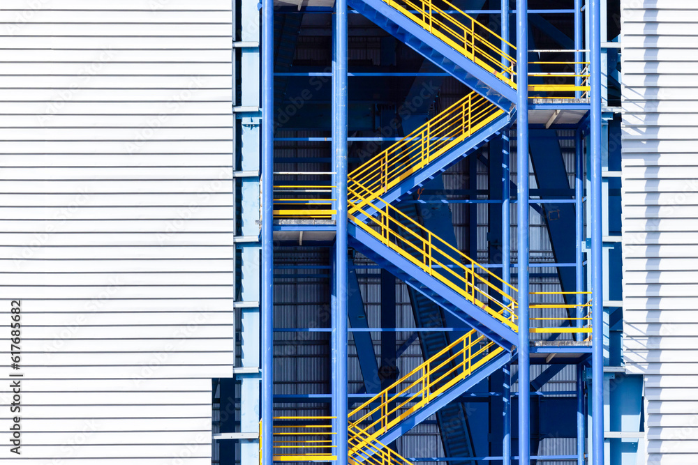 Metal construction fire escape ladder with blue and yellow . .Escape ...