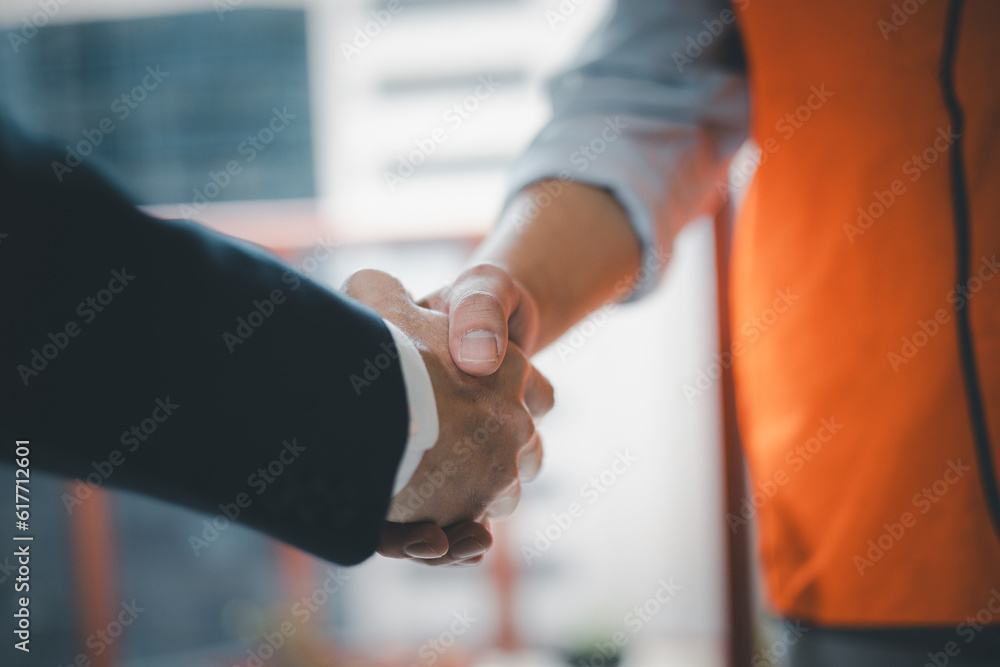 Engineers, designers and interior designers are handshake shack hands ...