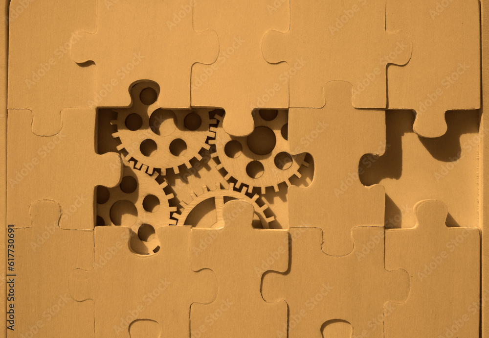 solving the problem concept - puzzles and cogwheels. wooden gears under ...