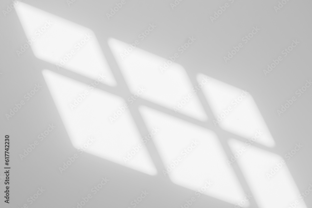 Abstract light reflection and grey shadow from window on white wall ...