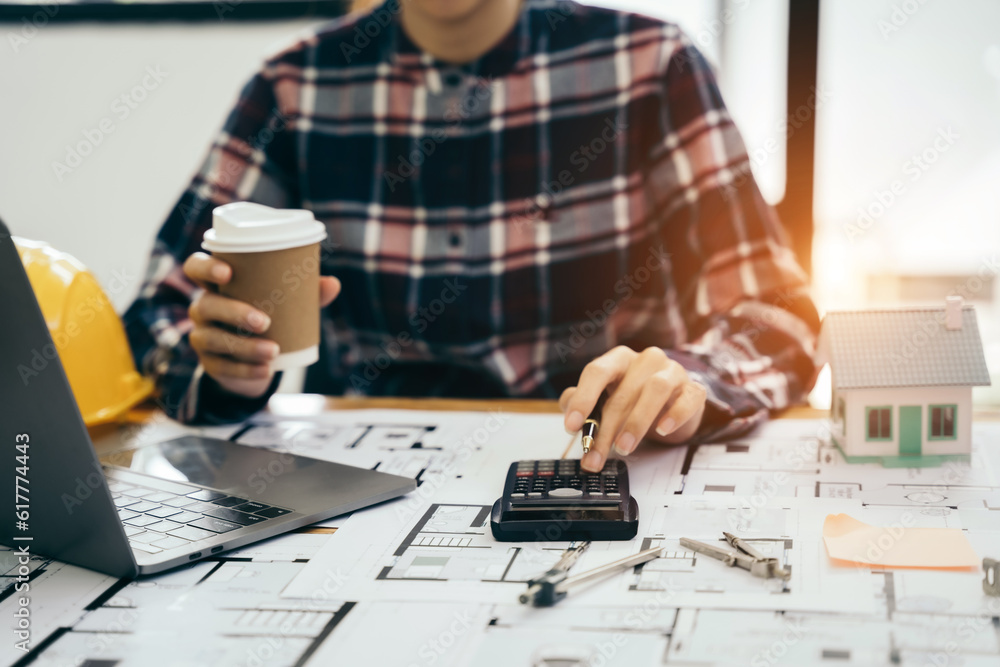 civil engineer or architect business useing calculator about calculate ...