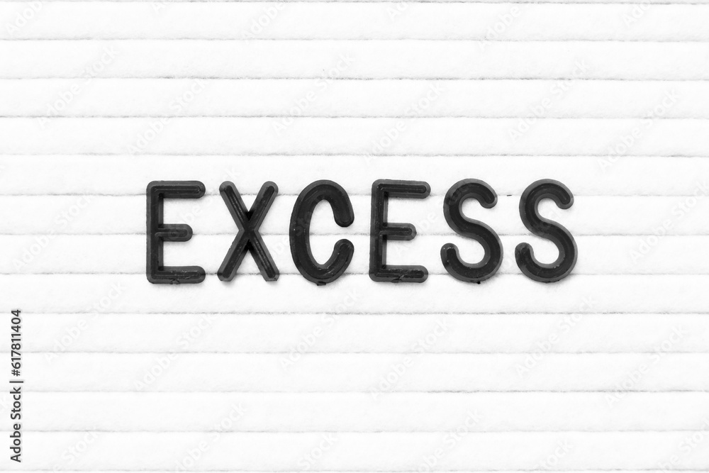 Black color letter in word excess on white felt board background Stock ...