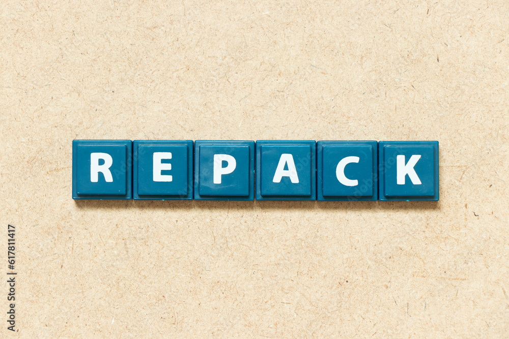 Foto de Tile alphabet letter in word repack on wood background do Stock ...