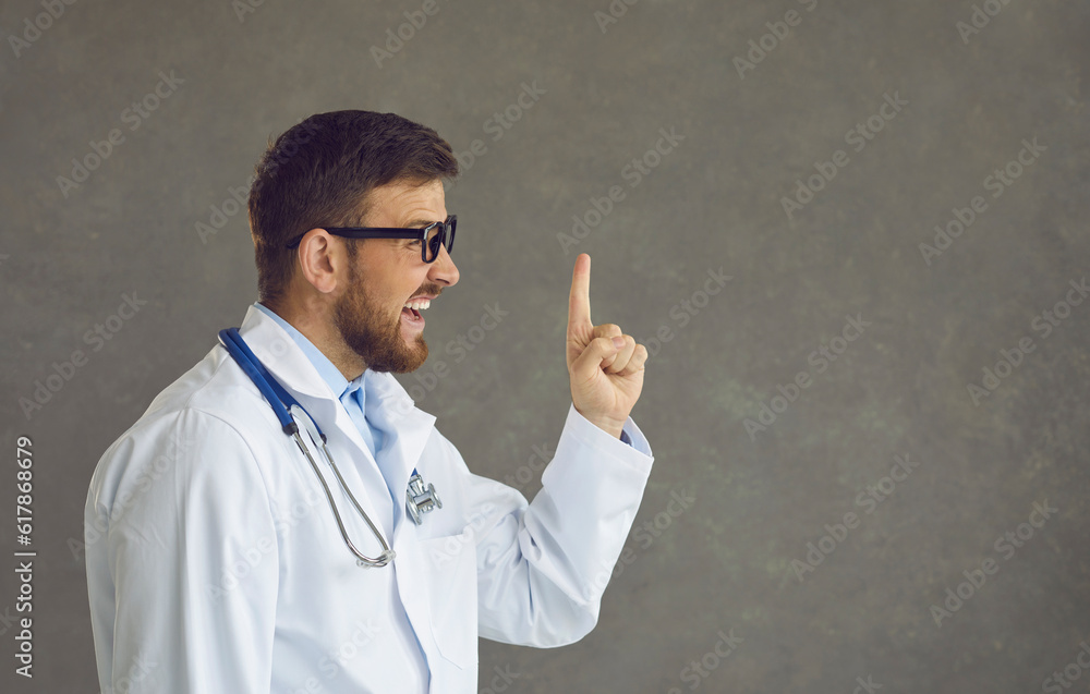 Have got an idea. Young doctor enjoying Aha moment. Side profile view ...