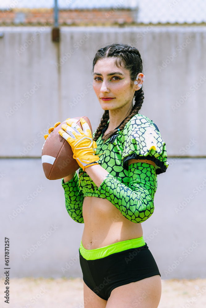 Portrait of mexican woman american football player wearing uniform with ...