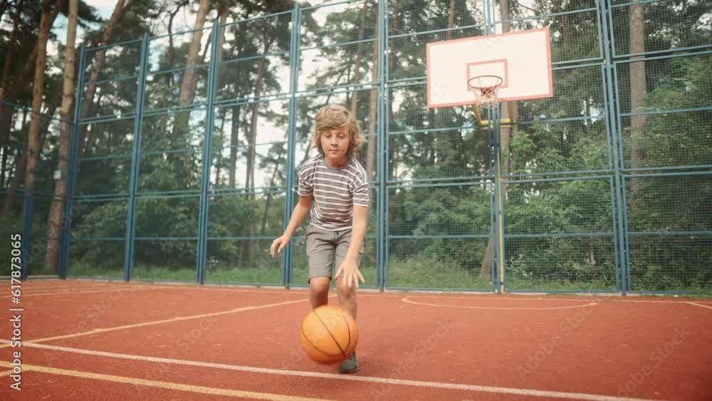 Camera moving. Little cute boy throwing ball on background of ...