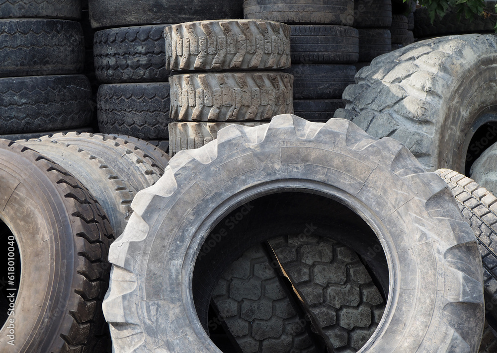 End-of-life vehicle tires in various sizes. Scrap tires for recycling ...