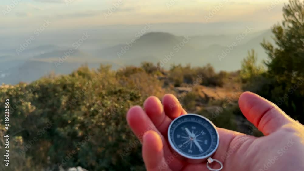 Compass in hand in mountains. Tourist compass for orientation on ...
