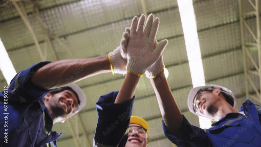Video Stock Team of factory workers celebrate a great success by ...
