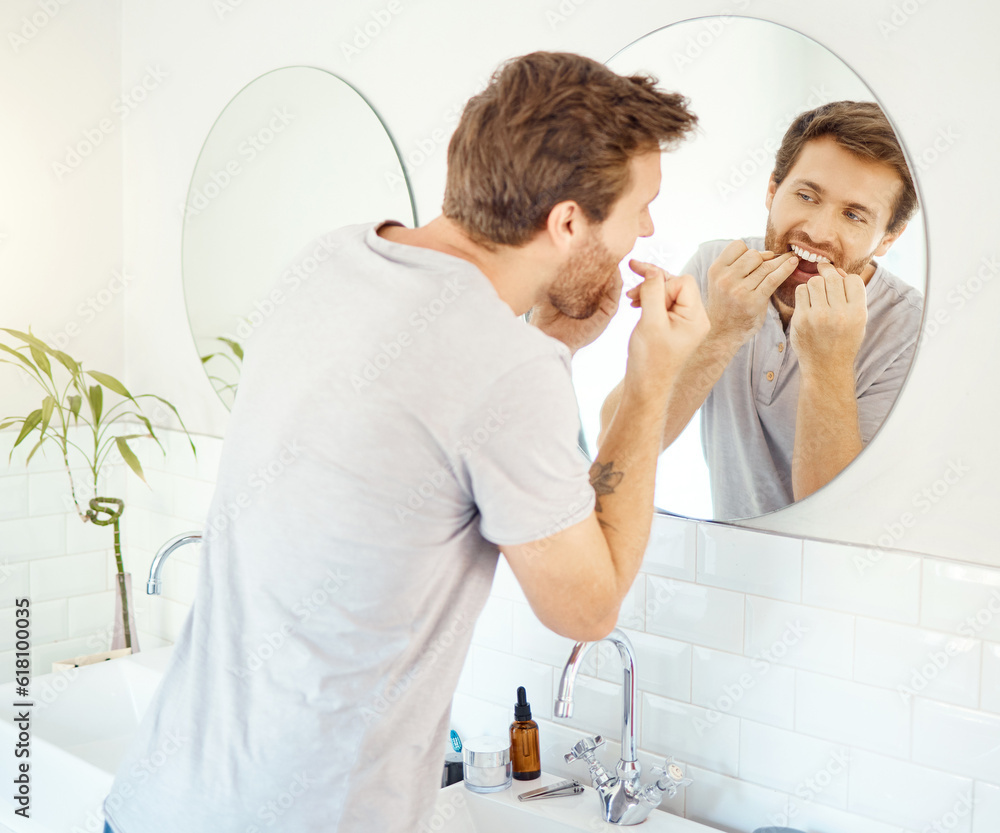 Dental floss, morning routine and mirror with man in bathroom for self care, oral hygiene and ...