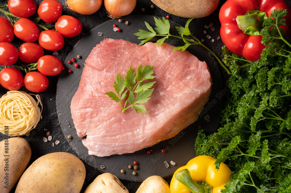 Fresh raw pork meat. A piece raw pork shoulder with spices and ...