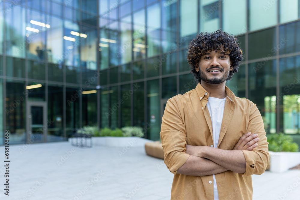 Portrait of young confident, handsome and intelligent Indian male ...
