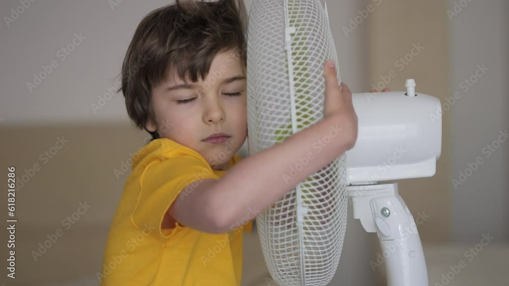 Child Enjoying Cool Wind From Electric Fan at Home at Summer Vacation ...