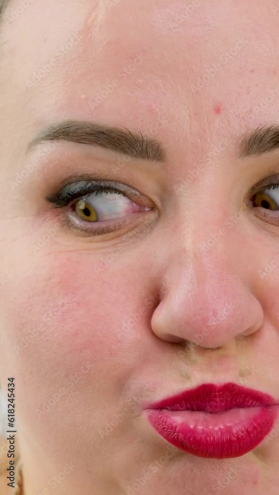 fat cheerful cute adult woman grimacing at the camera showing tongue ...