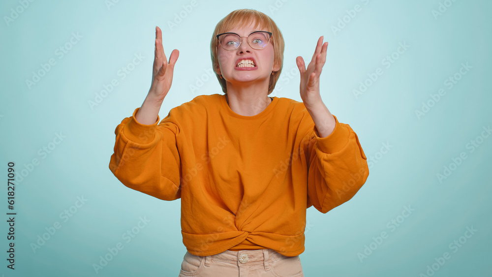 Young woman scared fearful, covering ears with hands, closing eyes ...