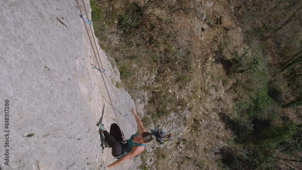 CLOSE UP: Woman falls after losing her grip while climbing a technical ...