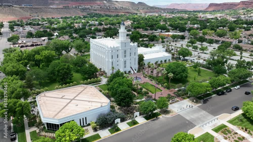 Aerial St George Utah LDS Temple tilt up turn. Pioneer temple during ...
