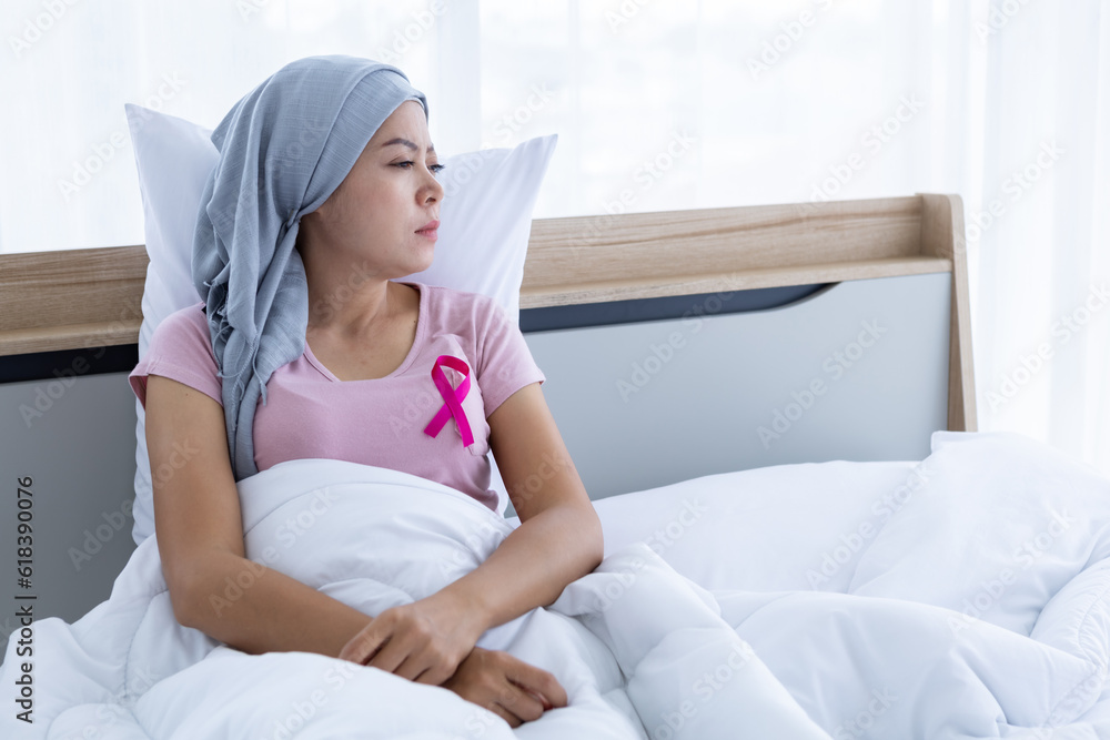 a asian women disease mammary cancer patient with pink ribbon wearing ...
