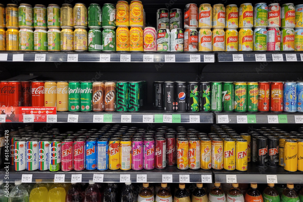 PENANG, MALAYSIA - 13 MAY 2023: Various brands of canned soft drinks ...