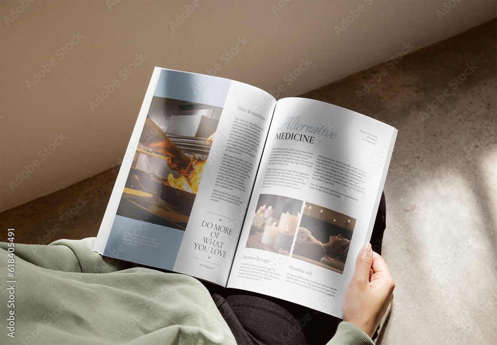 Mockup of person reading open vertical A4 magazine with customizable ...