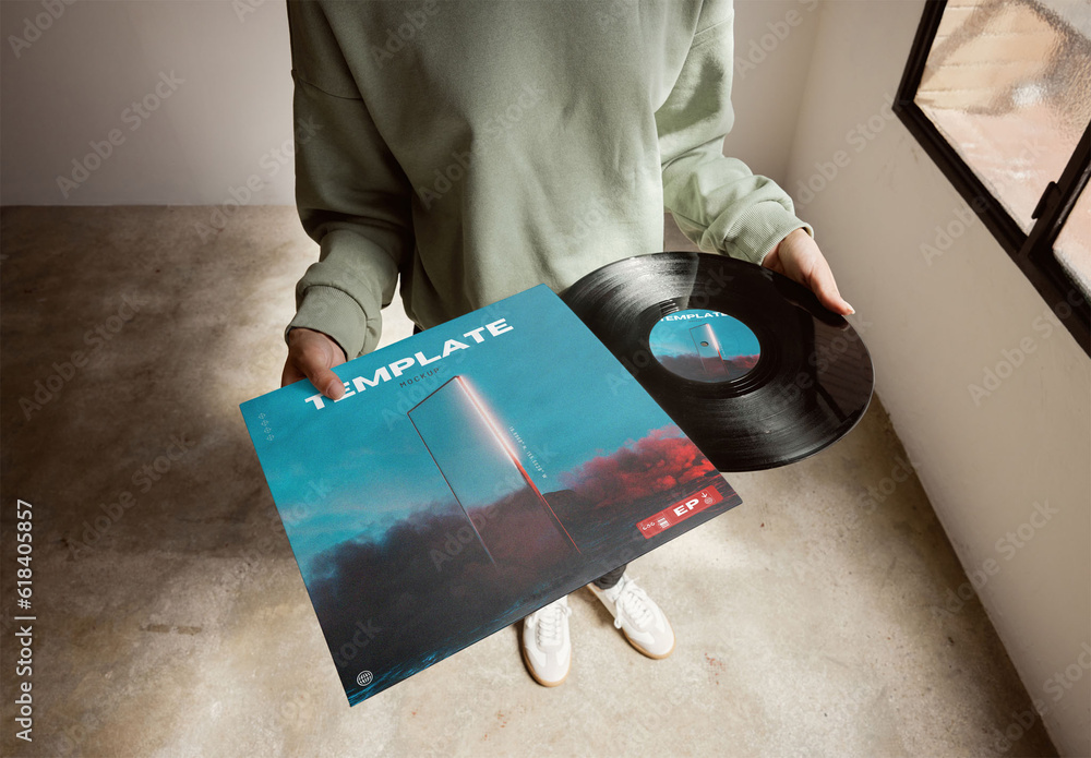 Mockup of person taking LP vinyl record out of customizable album cover ...