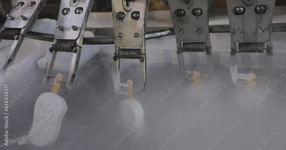 Industrial production of ice cream. Ice cream on a stick. Ice cream ...