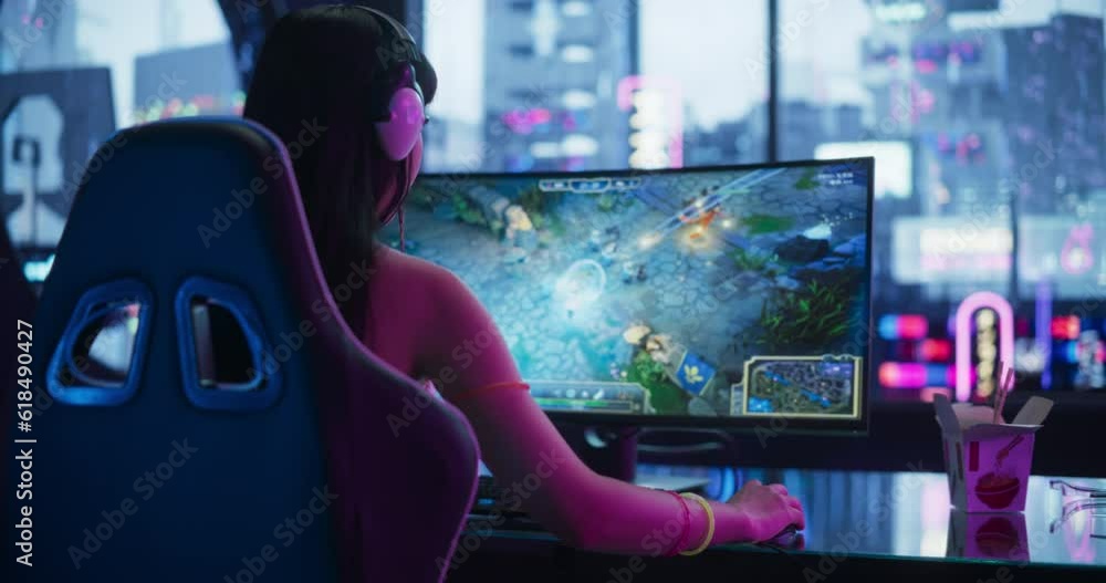 Japanese Female Gamer Playing Online RPG Strategy Video Game on a ...