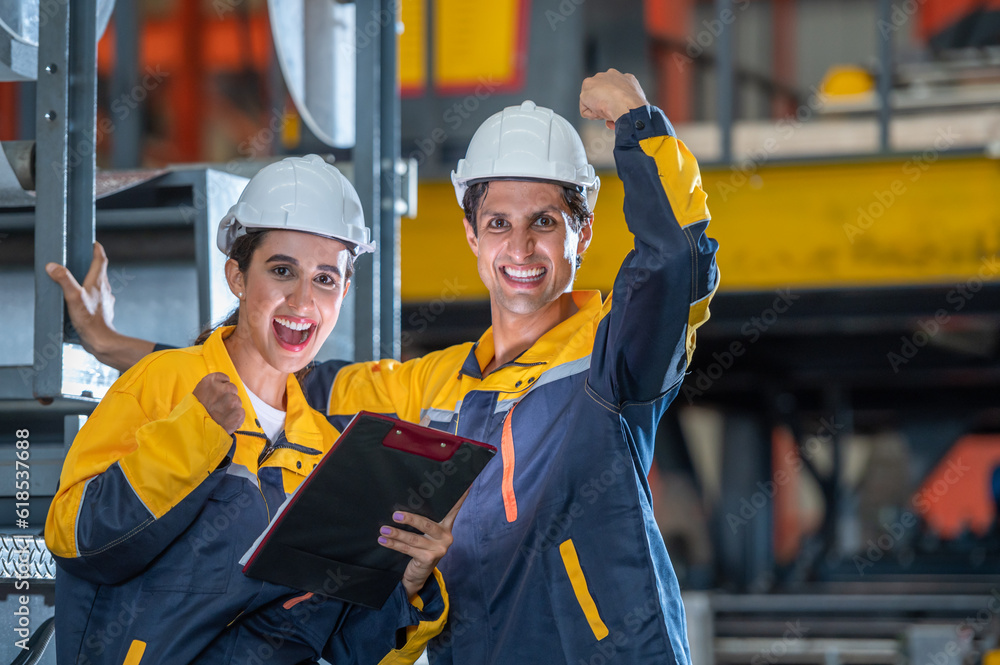 Man mentor and young employee trainee stand for operating machine ...