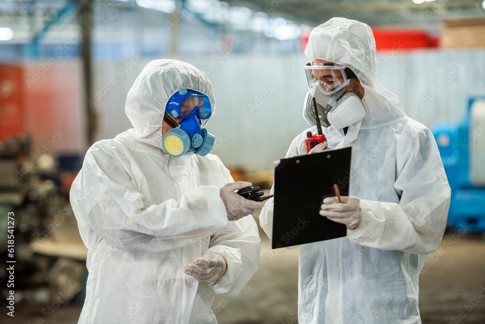 Male inspector team investigate danger chemical gas leak spill with ...