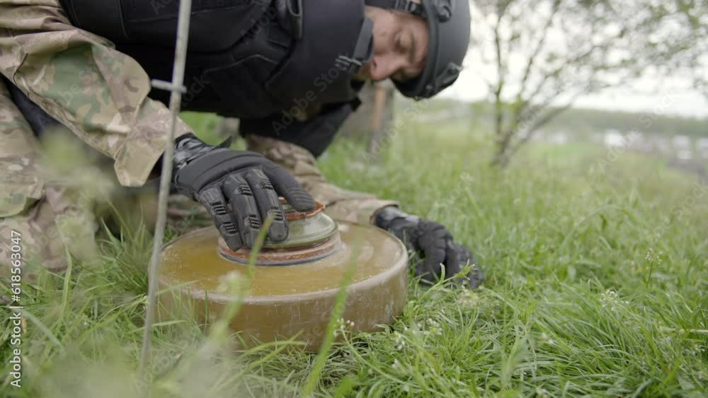 Video „Military sapper demining an anti-tank mine in the field near the ...