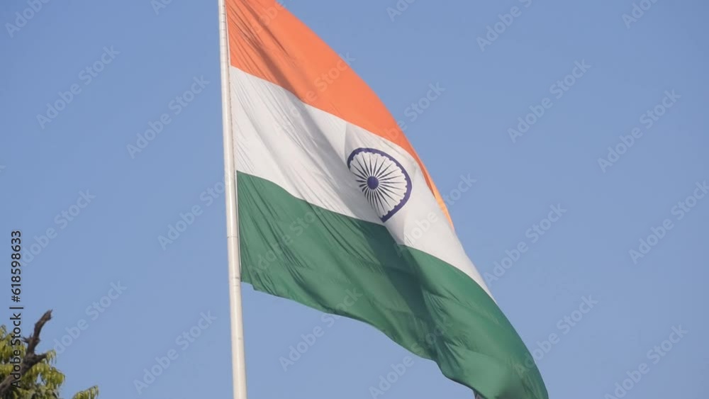 India flag flying high at Connaught Place with pride in blue sky, India ...