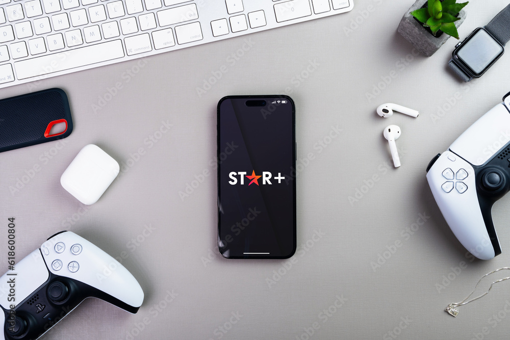 Star+ (StarPlus) app on the smartphone iPhone 14 Pro screen on gray ...