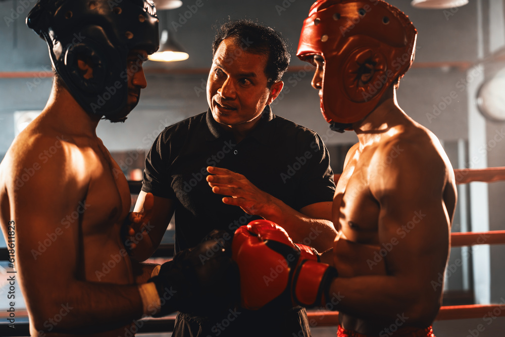 Boxer fighter with safety helmet or head guard face off with each other ...