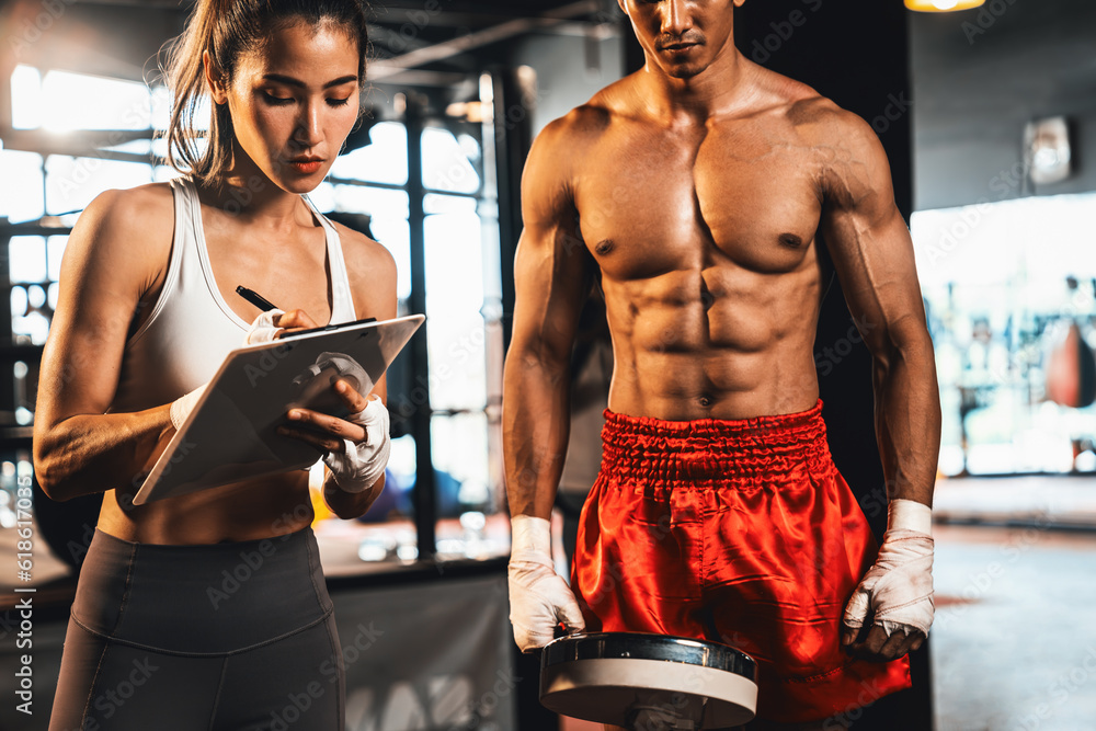 Muay Thai boxer step on weight scale for boxing class designation by ...