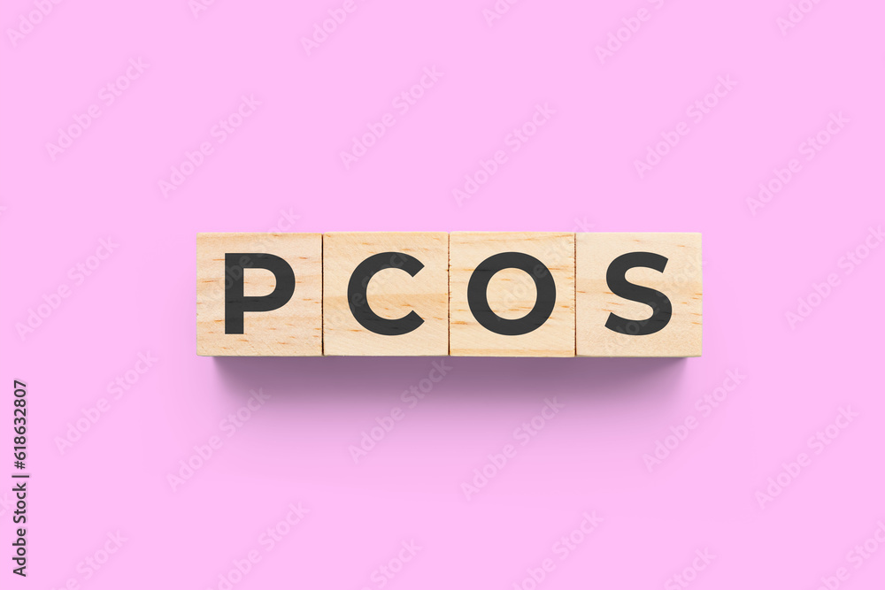 PCOS (Polycystic Ovary Syndrome) wooden cubes on pink background Stock ...
